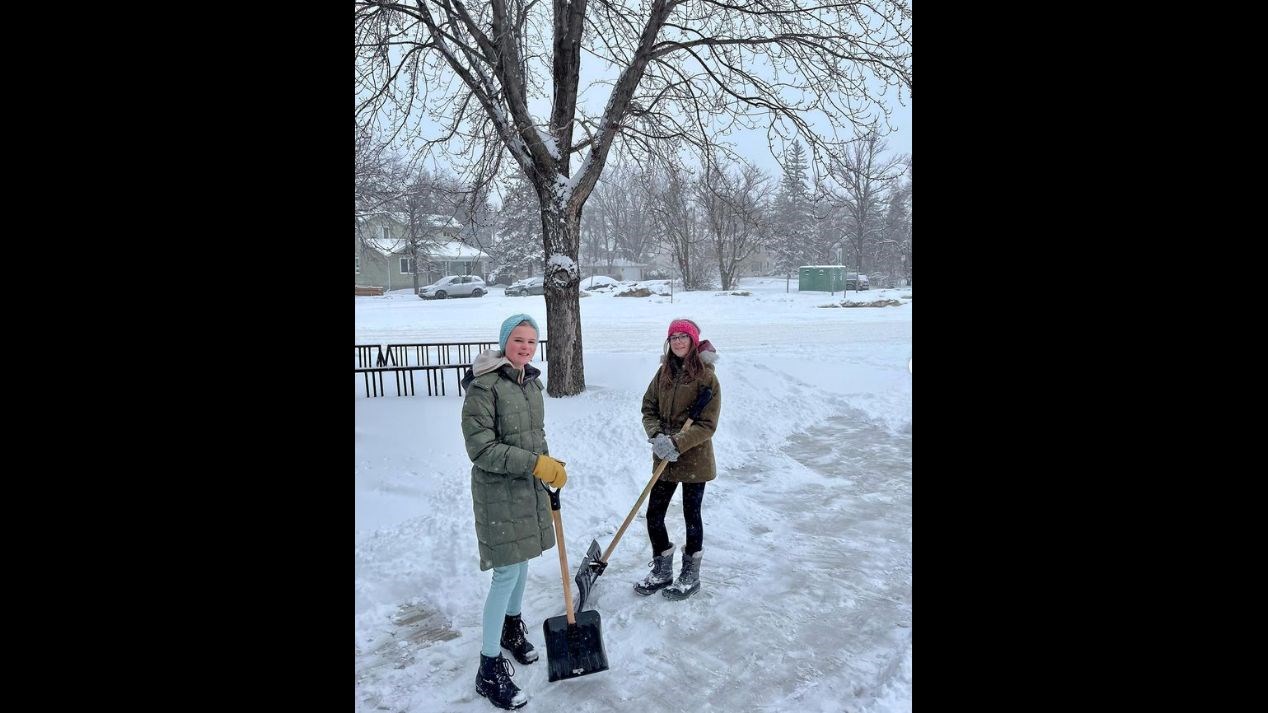 Hard Working Students Helping Clear The Snow First Thing In The Morning